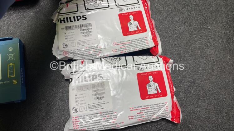 2 x Philips Heartstart HS1 Defibrillators with 4 x Batteries and 4 x ...