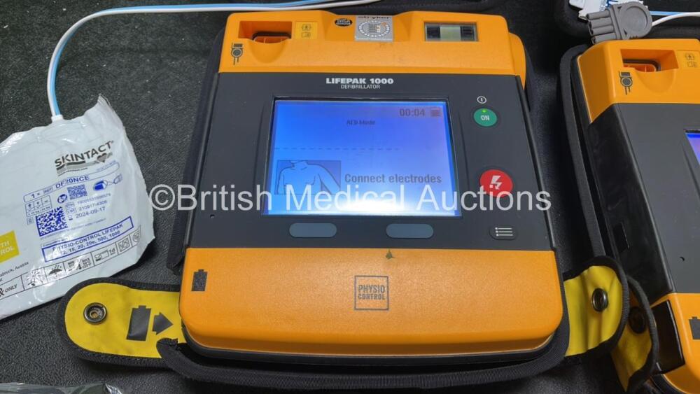 2 x Medtronic Physio-Control Lifepak 1000 Defibrillators with 4 x ...